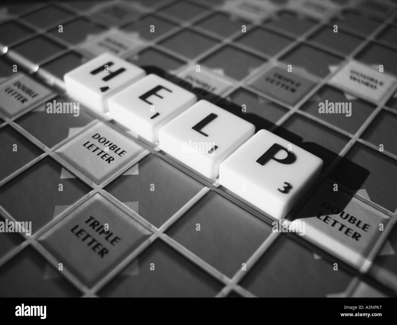 Scrabble hand Black and White Stock Photos & Images - Alamy