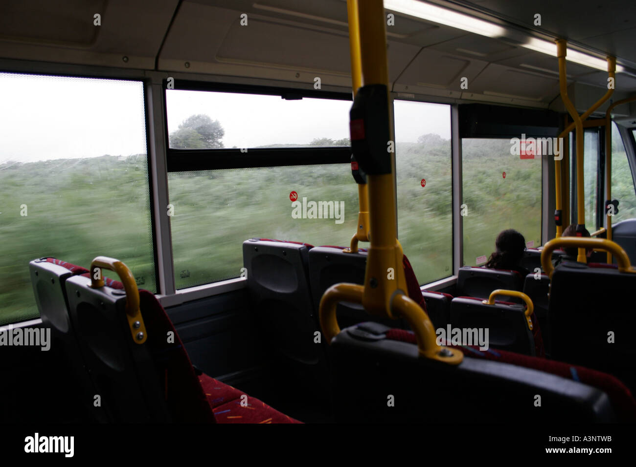 VIEW OUT THROUGH A BUS WINDOW ON A RAINY DAY, LUSH SUMMER COUNTRYSIDE ...