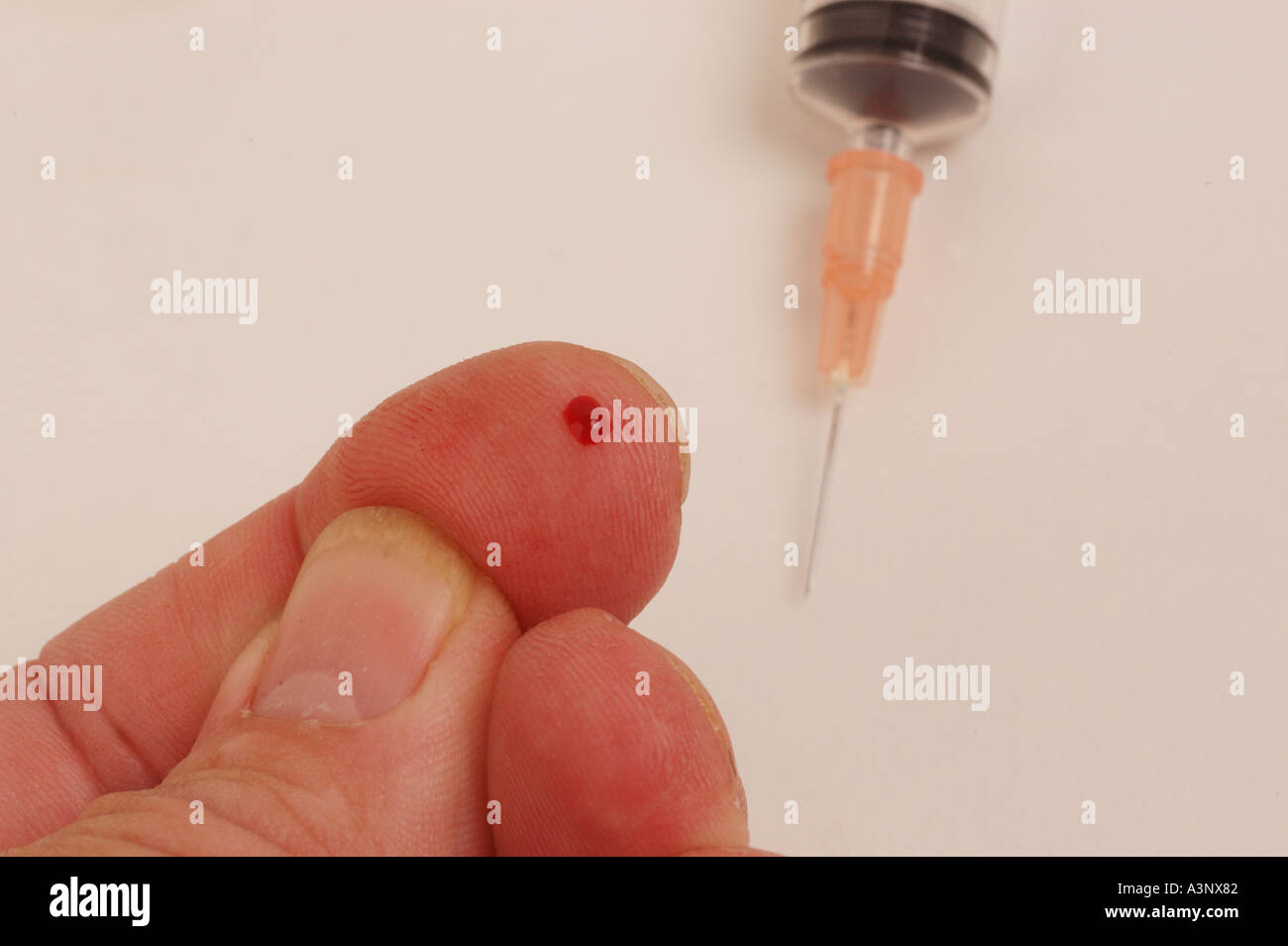 Finger stabbed by syringe dsca 0786 Stock Photo - Alamy