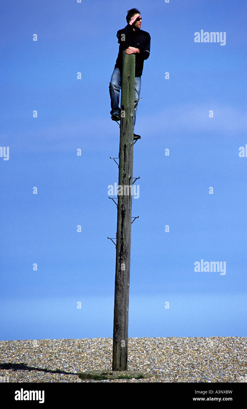 A man on top of a lookout post, Aldeburgh, Suffolk, UK Stock Photo - Alamy