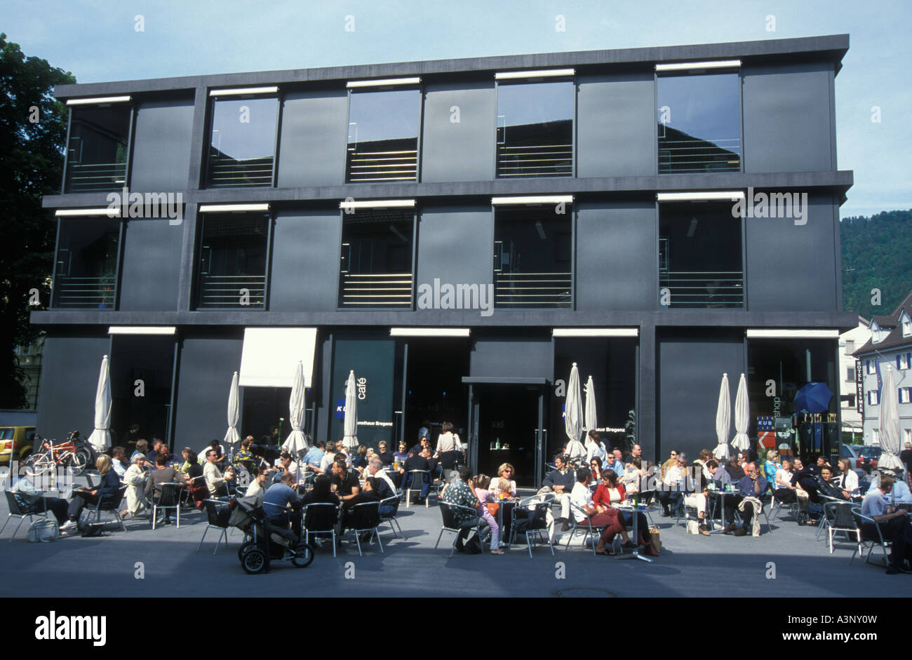 People at the caf of the Kunsthaus Bregenz museum in Bregenz Lake ...