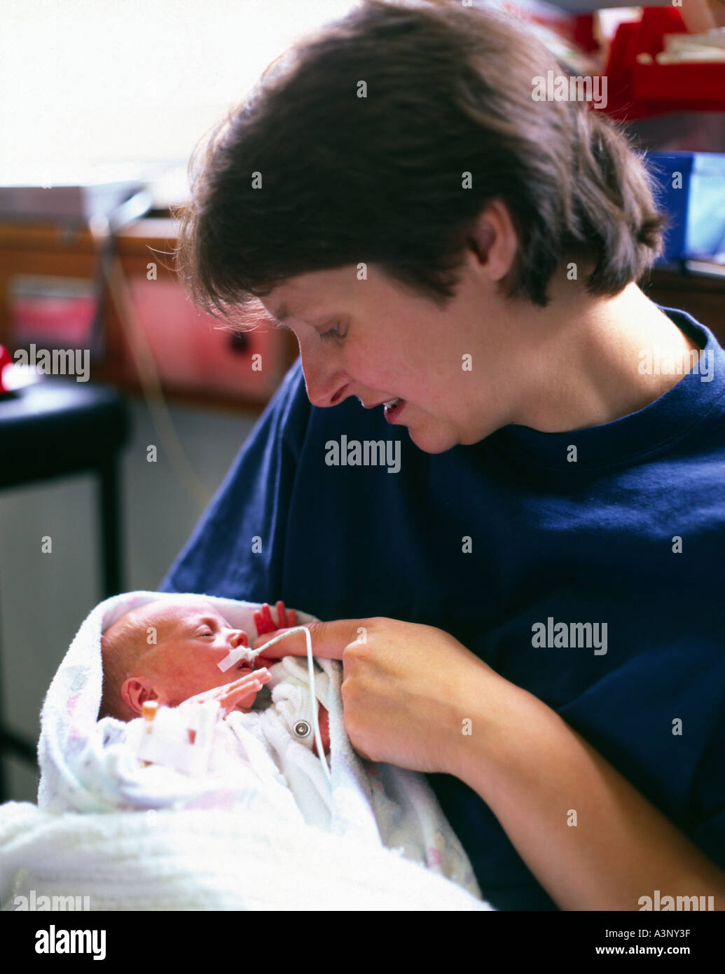 Maternal cradling hi-res stock photography and images - Alamy