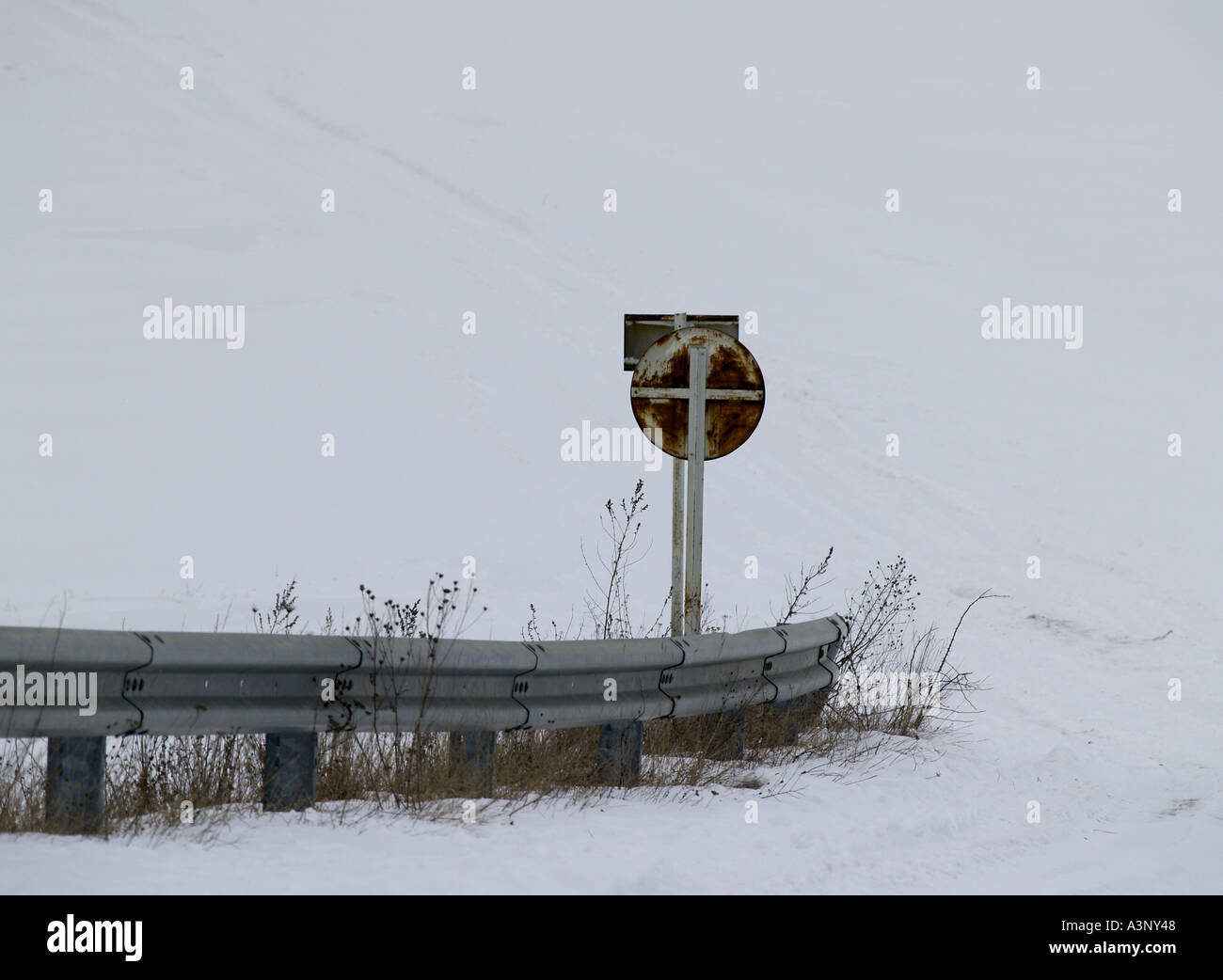 snow covered street with traffic sign Stock Photo - Alamy