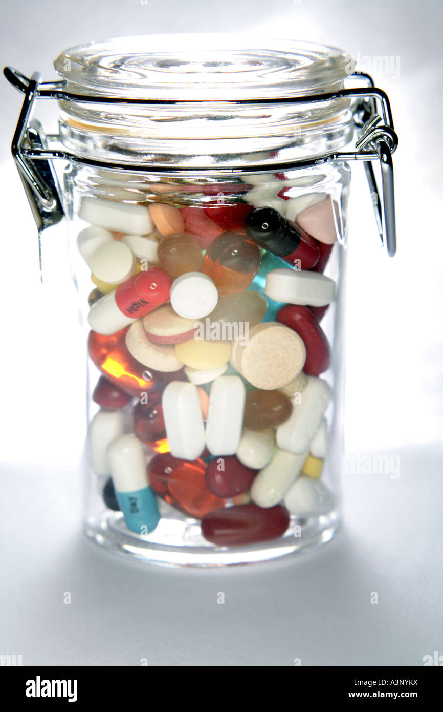 Pills in jar Stock Photo - Alamy