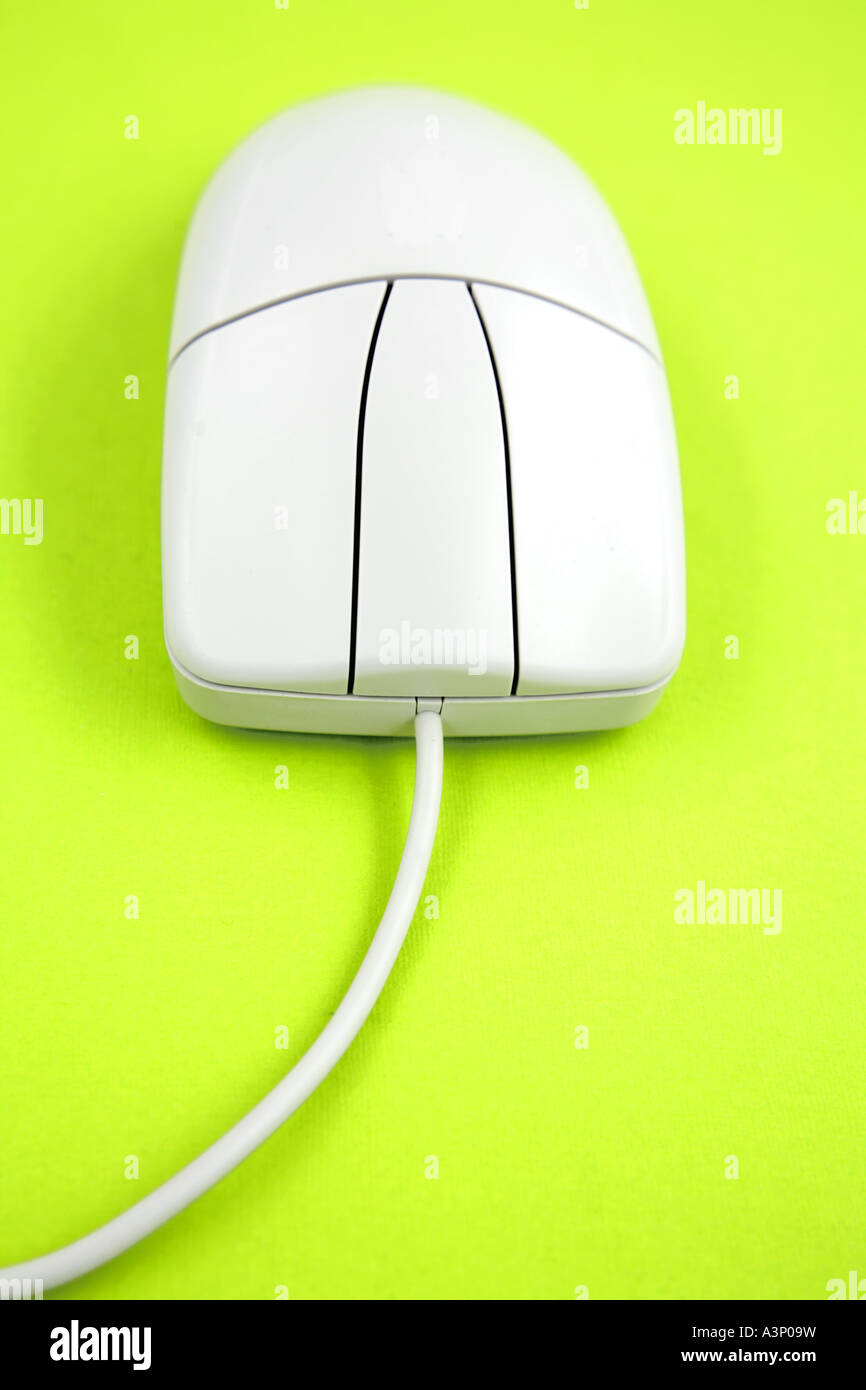 Computer mouse on green background Stock Photo - Alamy