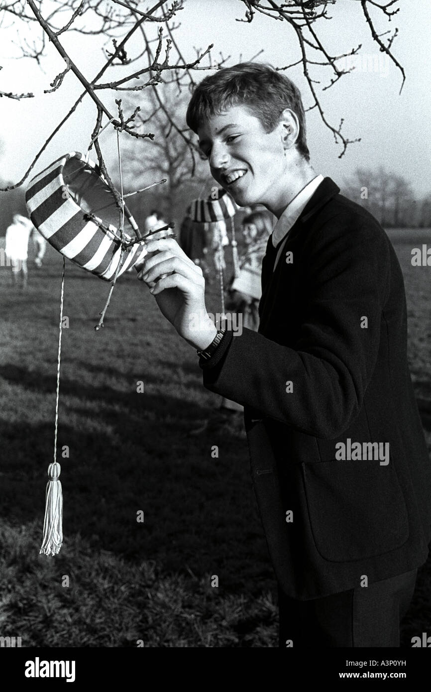Harrow School pupil viewing the fez's which hang from the trees during ...