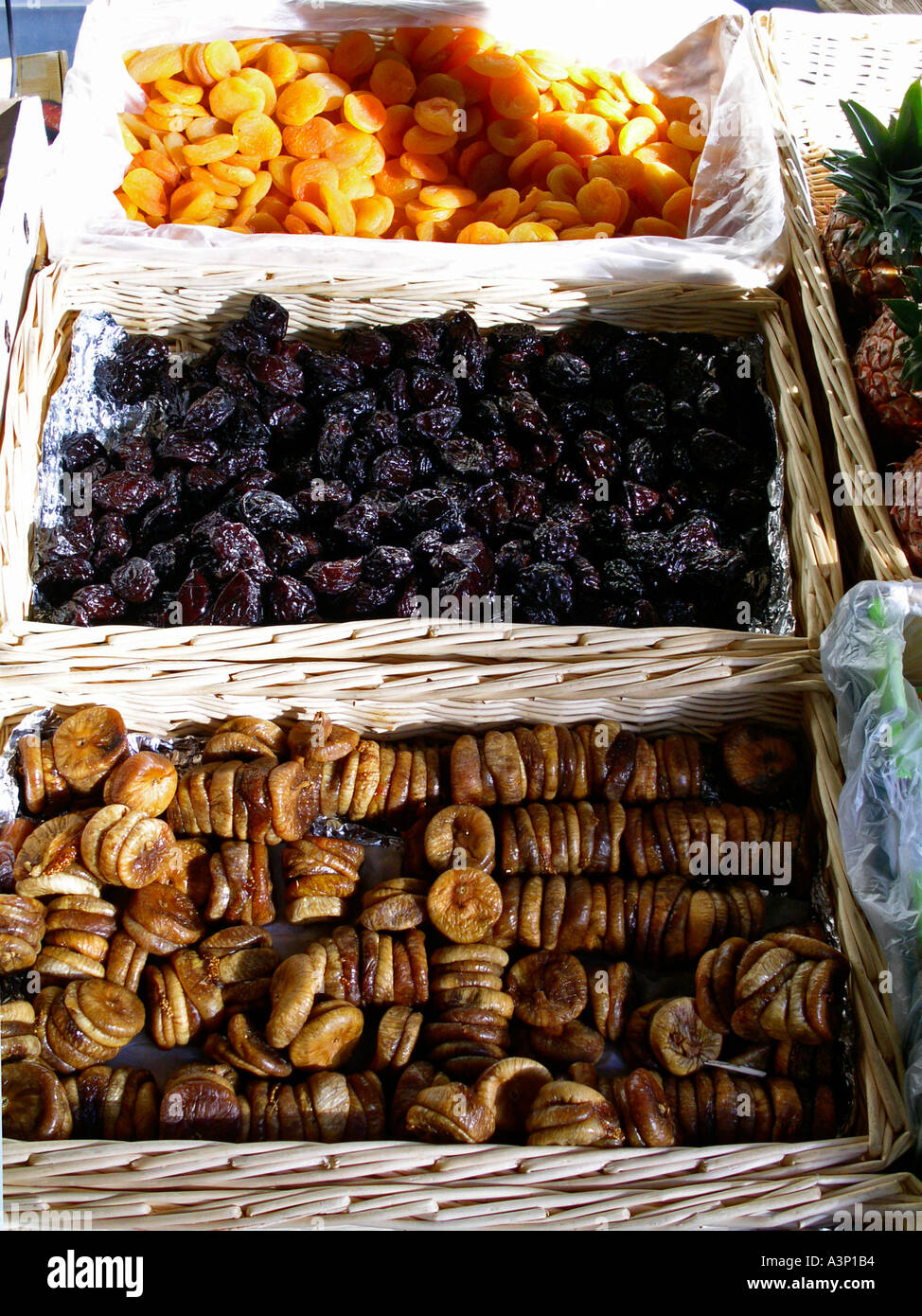 French market stall with dried figs prunes and apricots in baskets ...