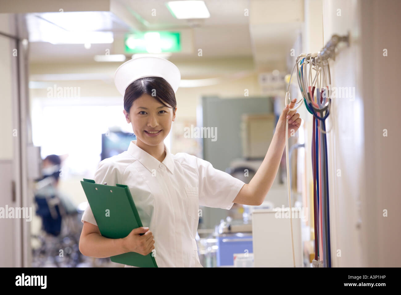 Female nurse checking stethoscopes at nurse station Stock Photo - Alamy
