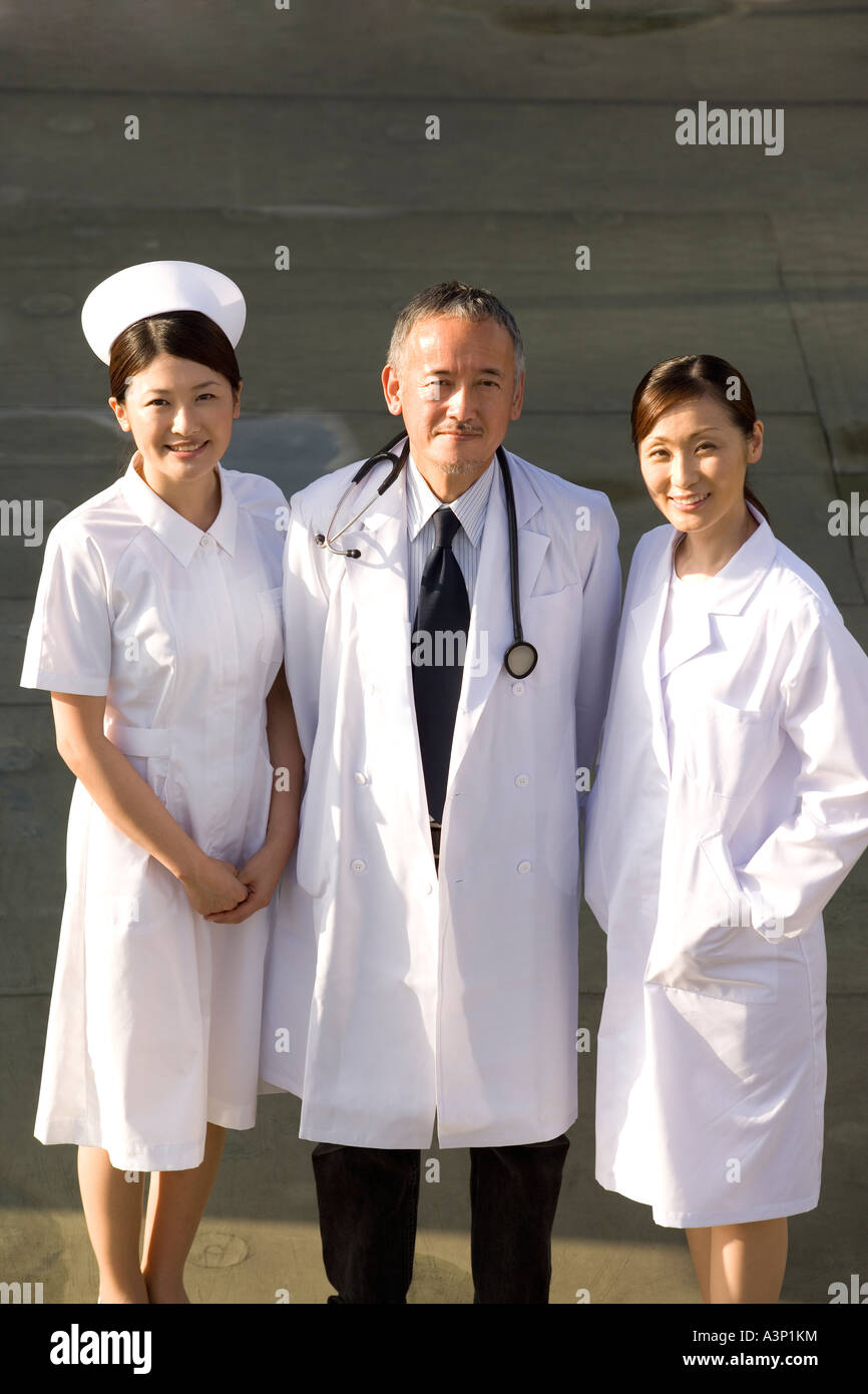 Two doctors and nurse standing Stock Photo - Alamy
