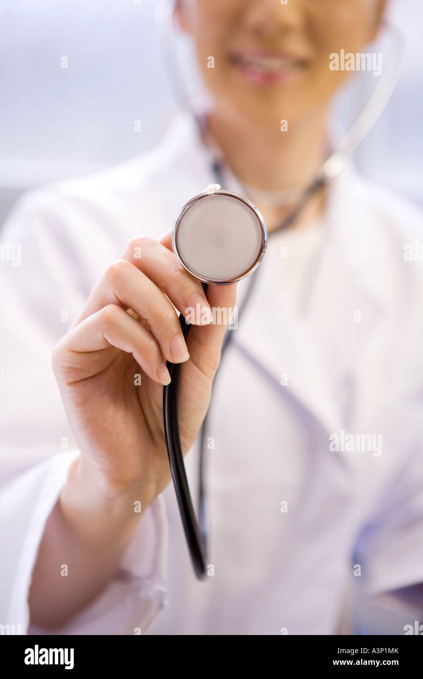 A female doctor examining patient with stethoscope Stock Photo - Alamy