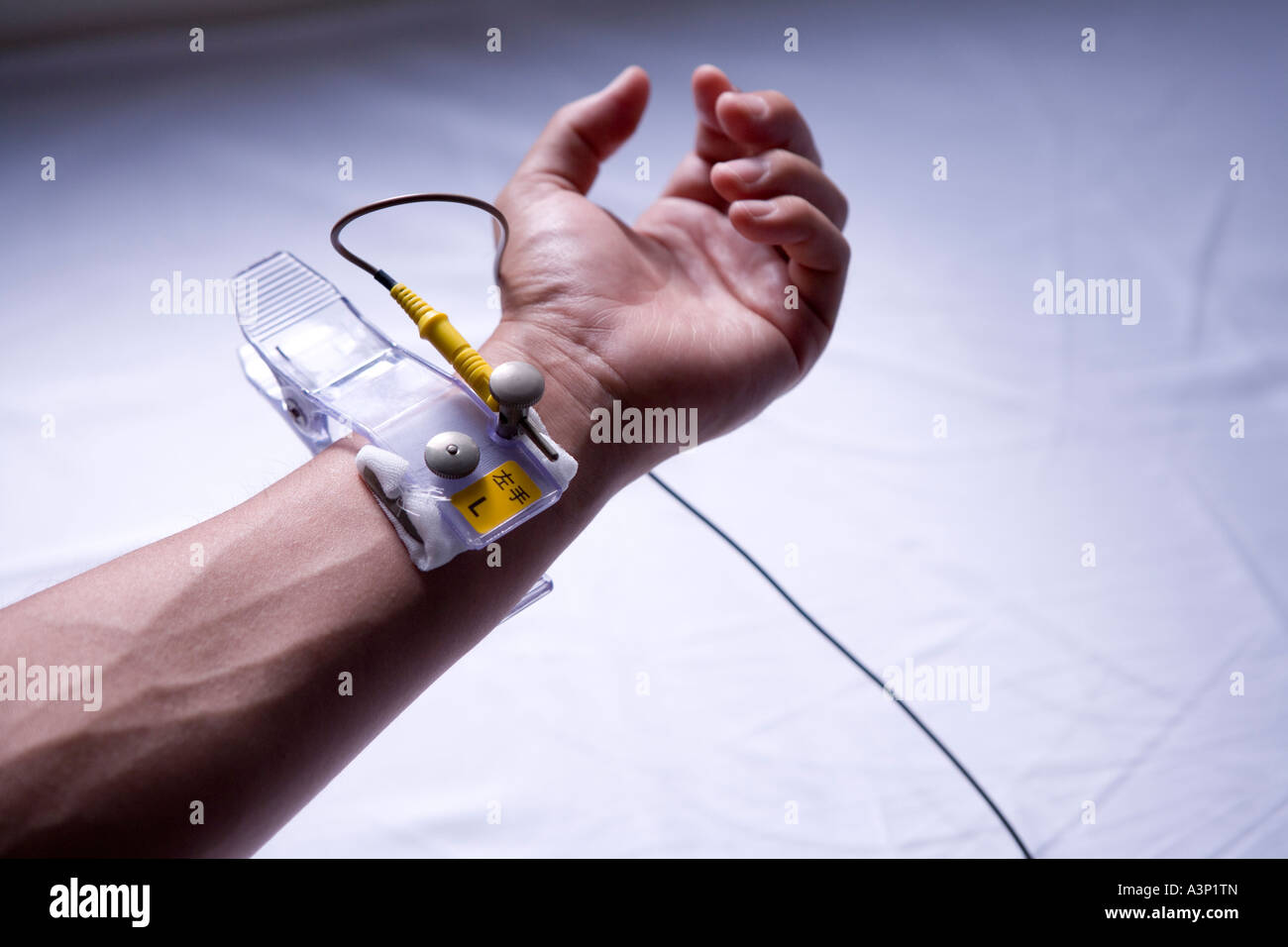 Man's hand connected to cardiac monitor Stock Photo - Alamy
