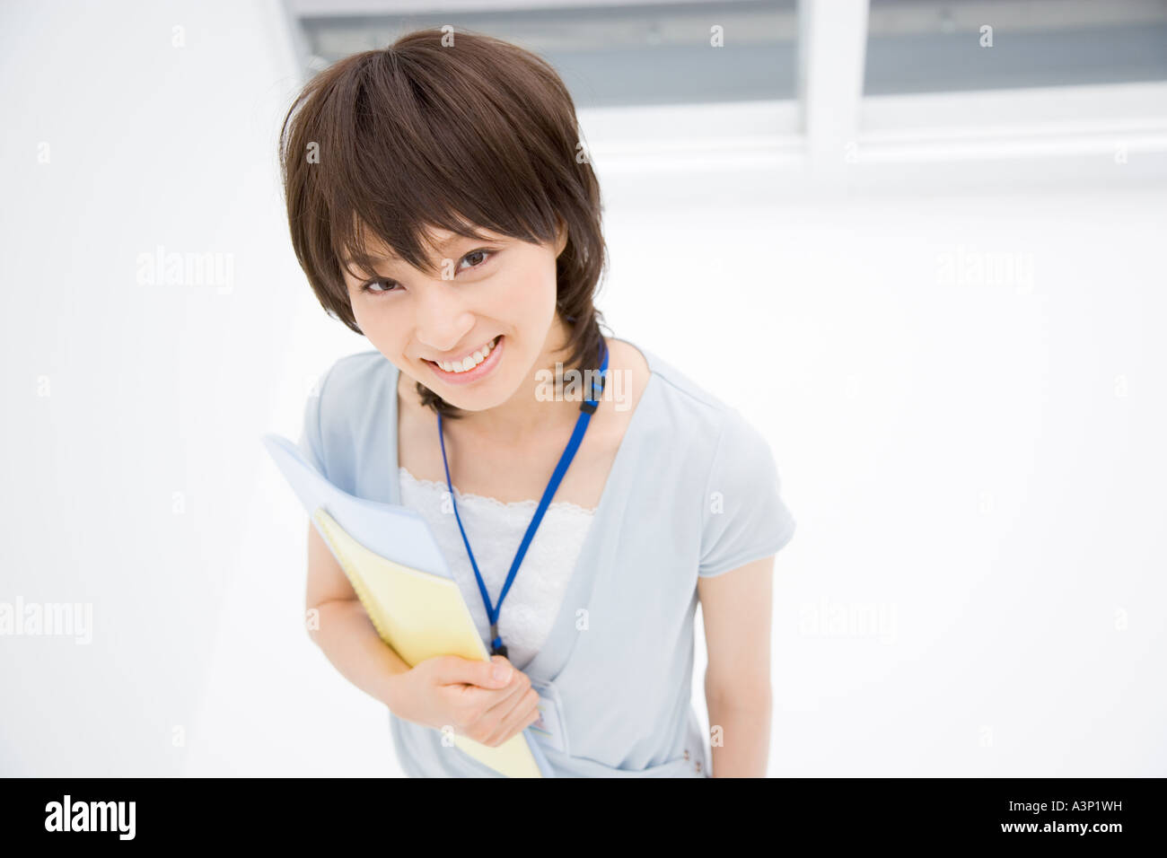 Young woman holding files Stock Photo - Alamy