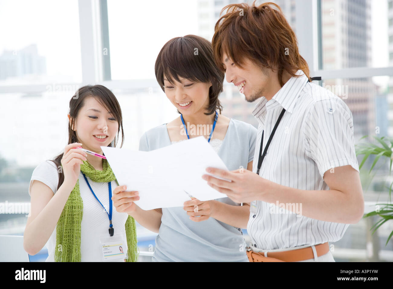 Three people talking Stock Photo - Alamy