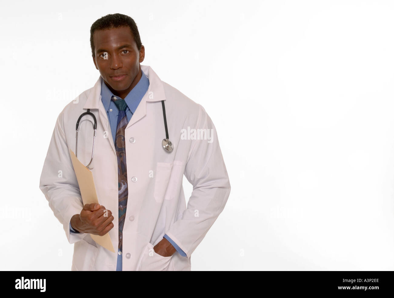 Confident African American male doctor with hand in pocket, wearing ...