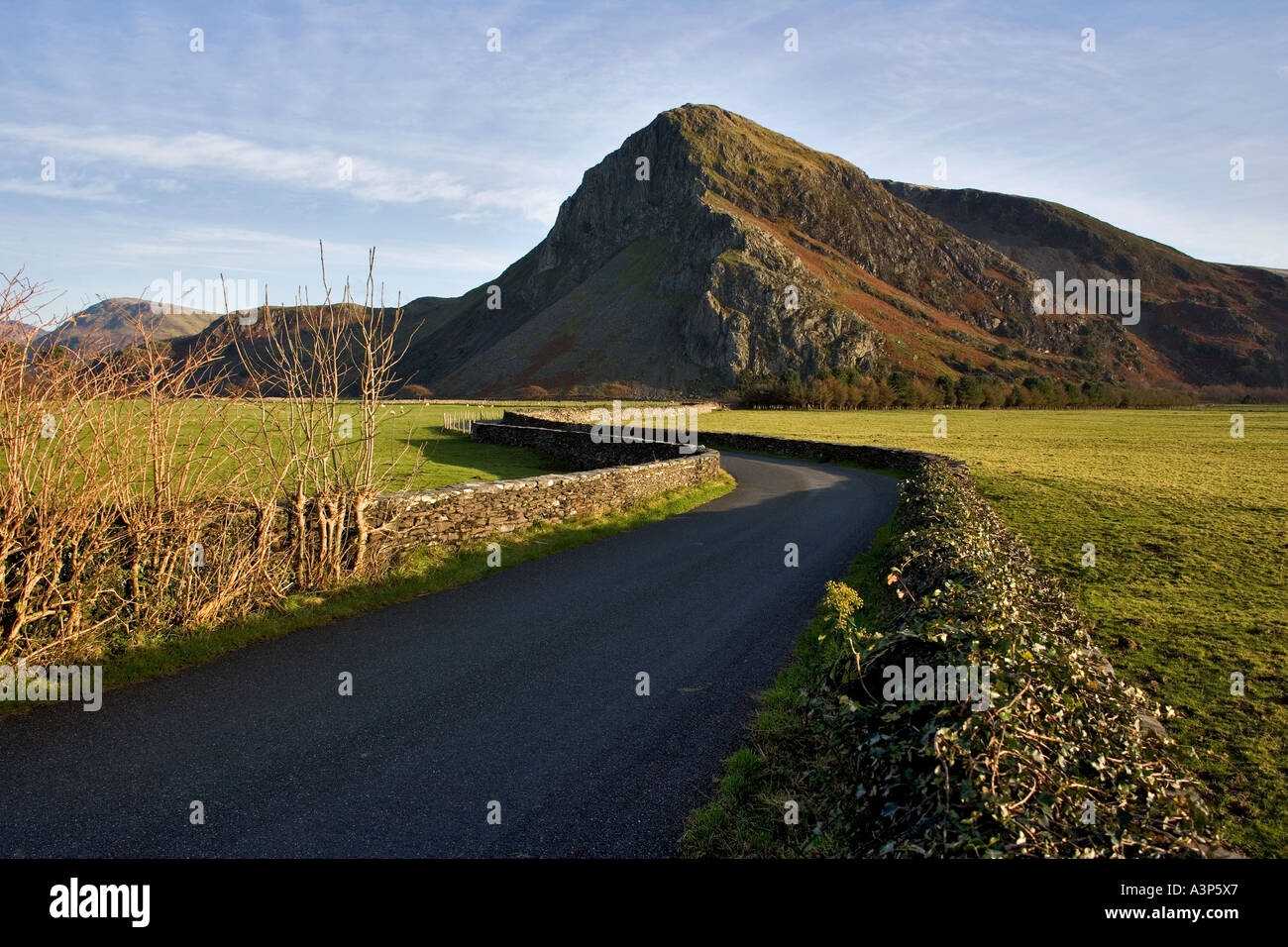 NARROW COUNTRY ROAD WITH CRAIG YR ADERYN BIRD ROCK KNOWN FOR NESTING ...