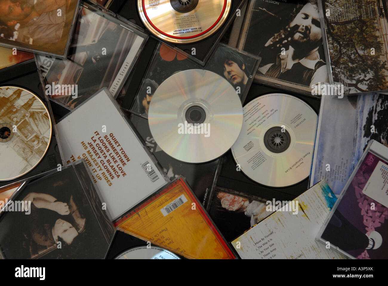 Scattered compact discs part of a large cd colection Stock Photo - Alamy