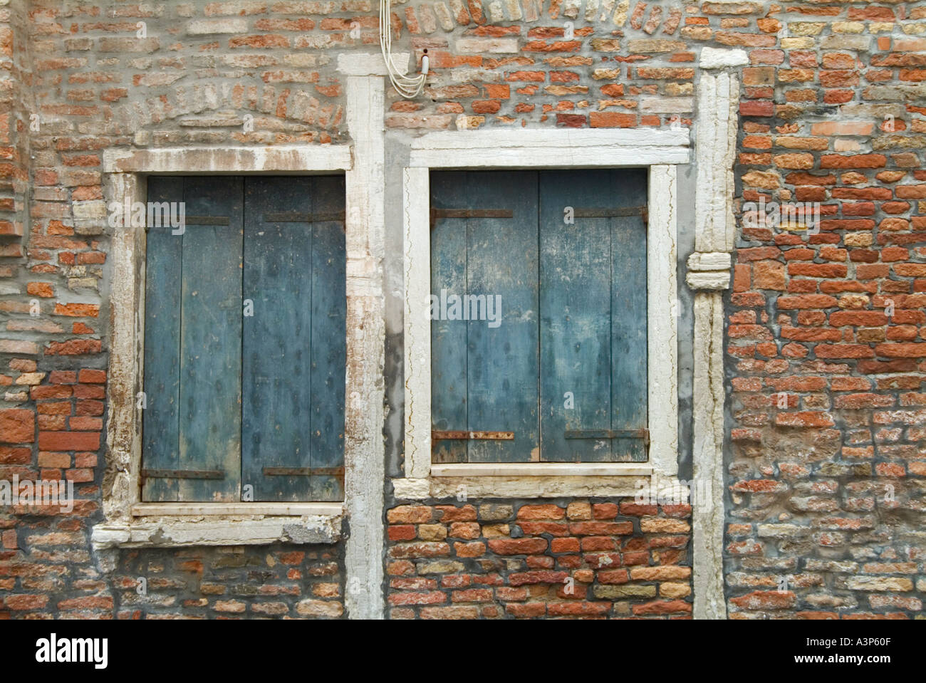 old wooden hatches in wall above canal Venice Veneto Italy Stock Photo ...
