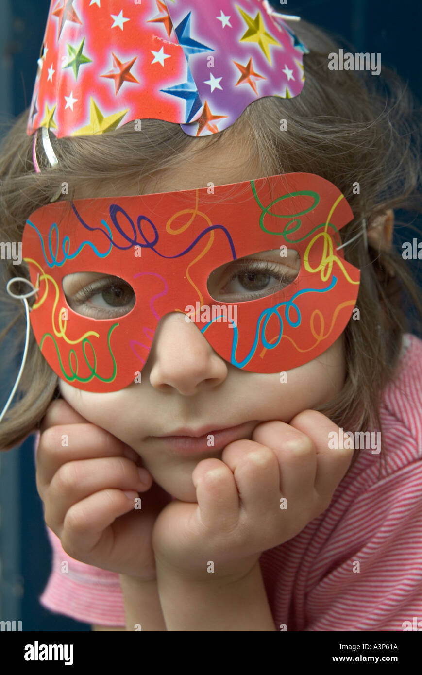 small girl at a party looking unhappy Stock Photo - Alamy