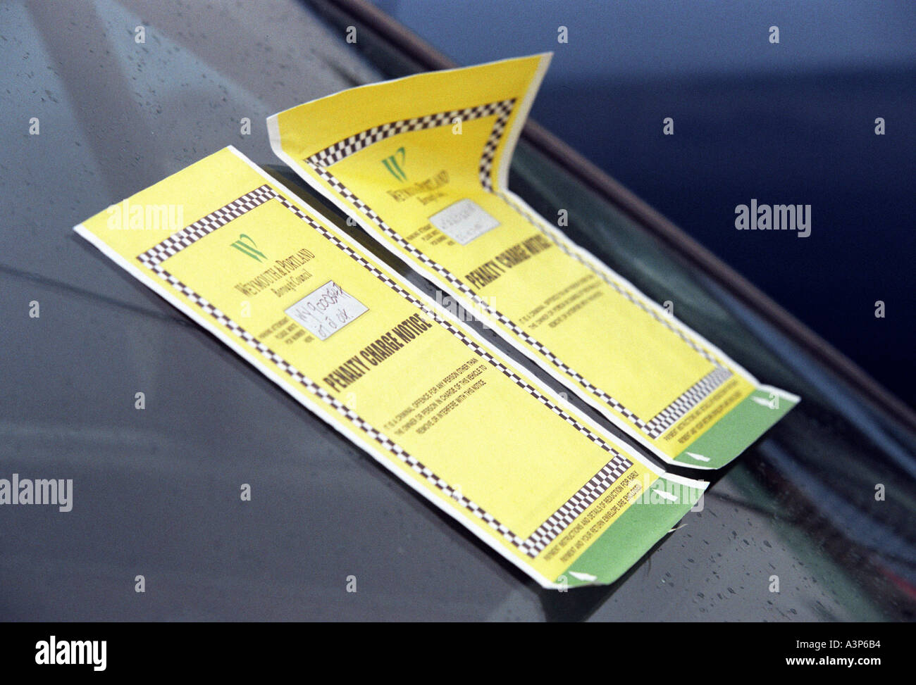 Two parking tickets on a car windscreen in Britain UK Stock Photo - Alamy