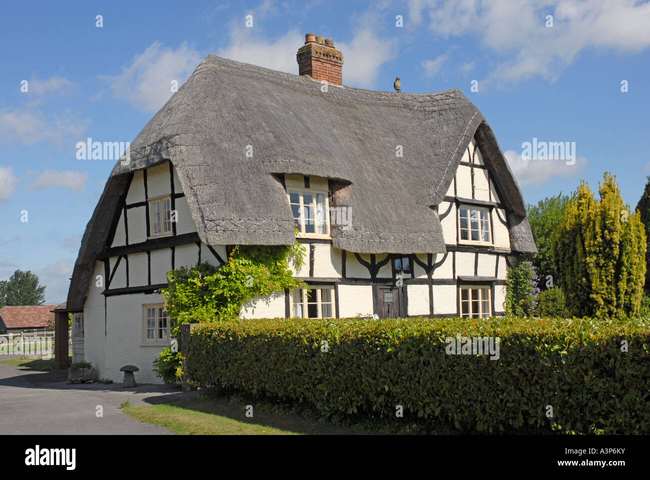 Thatched house/farm building with half timbered walls, Wiltshire ...