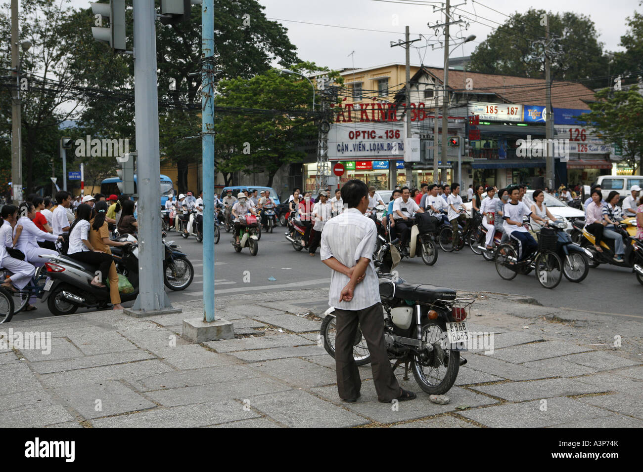 Man wathing the traffic jam with motor bikes (Ho Chi Minh City, Vietnam ...