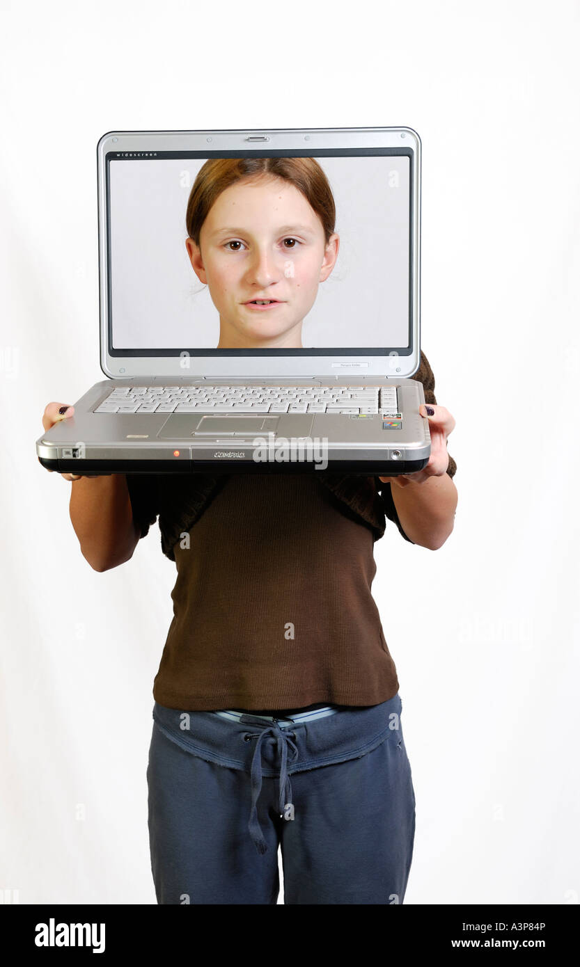 Teenager girl talking and communicating through a laptop by holding the ...