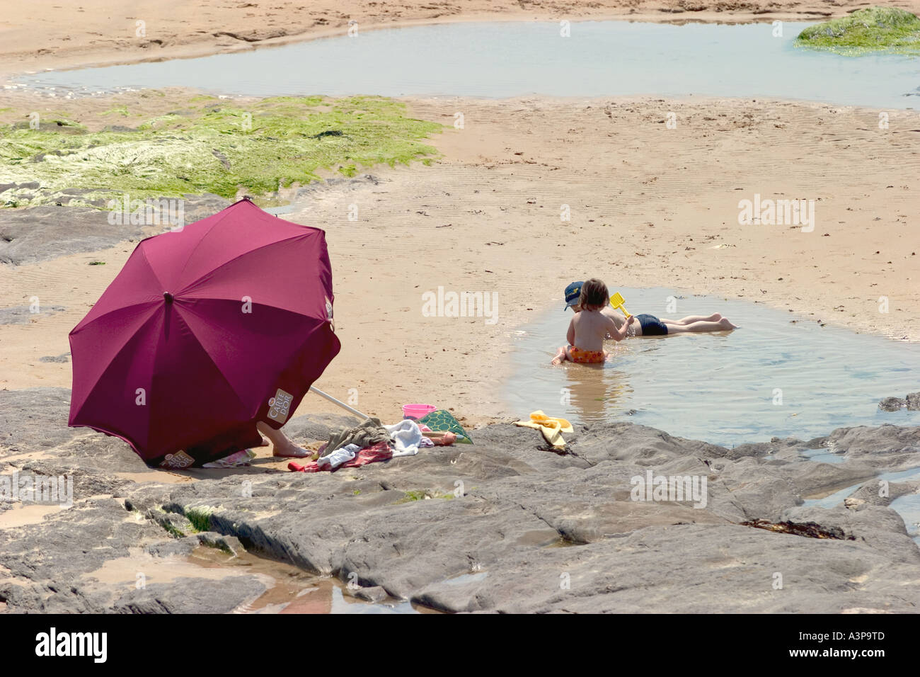 Group of people relaxing on beach under tent hi-res stock photography ...