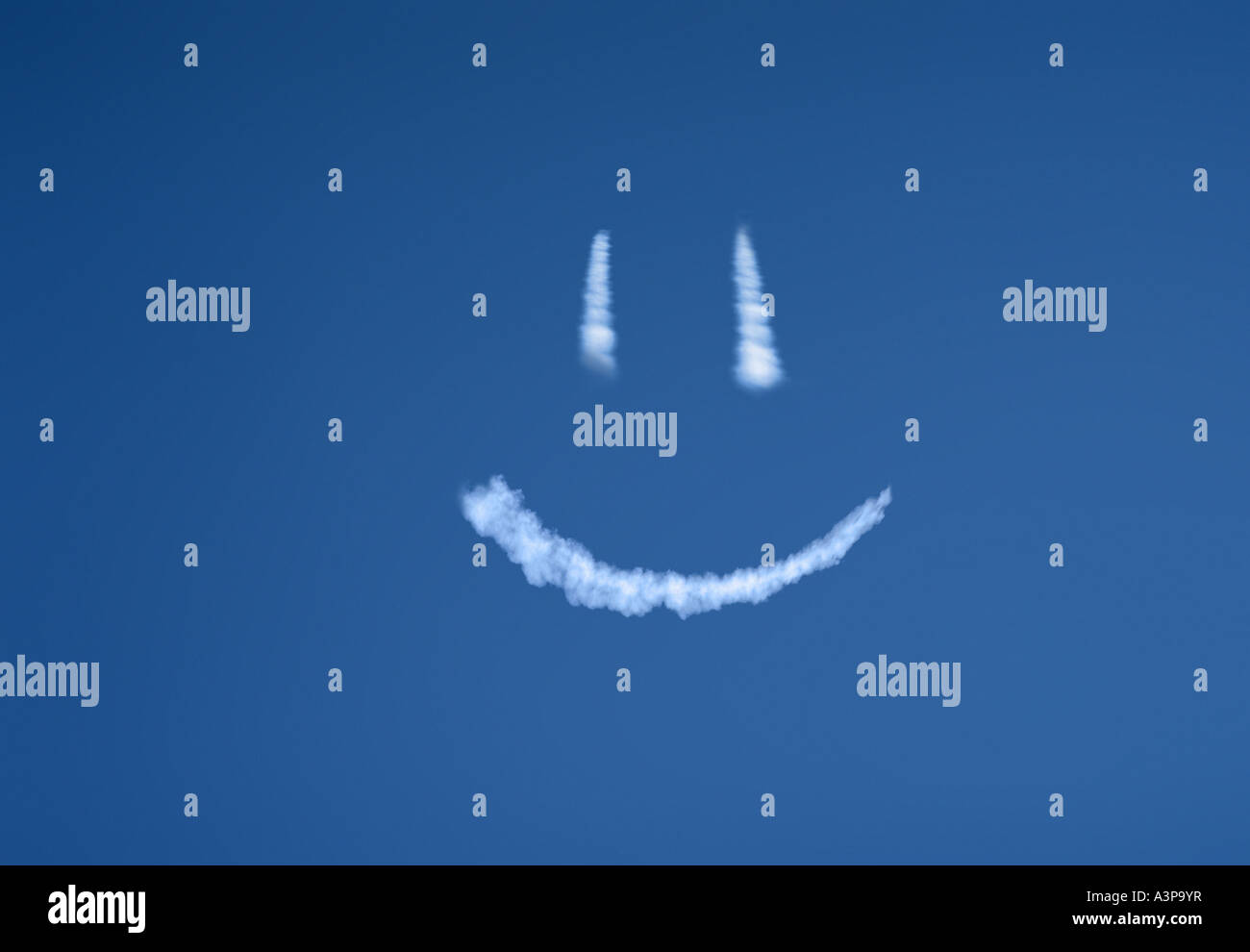 Smiley face in smoke trail from skywriting Stock Photo - Alamy