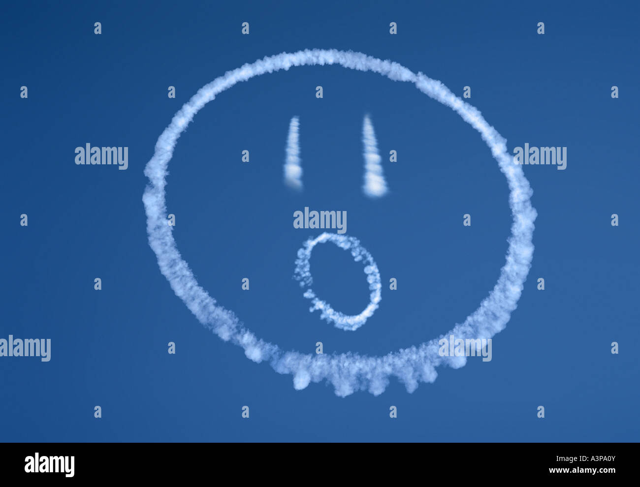 Smiley face with an astonished or surprised expression in smoke trail ...