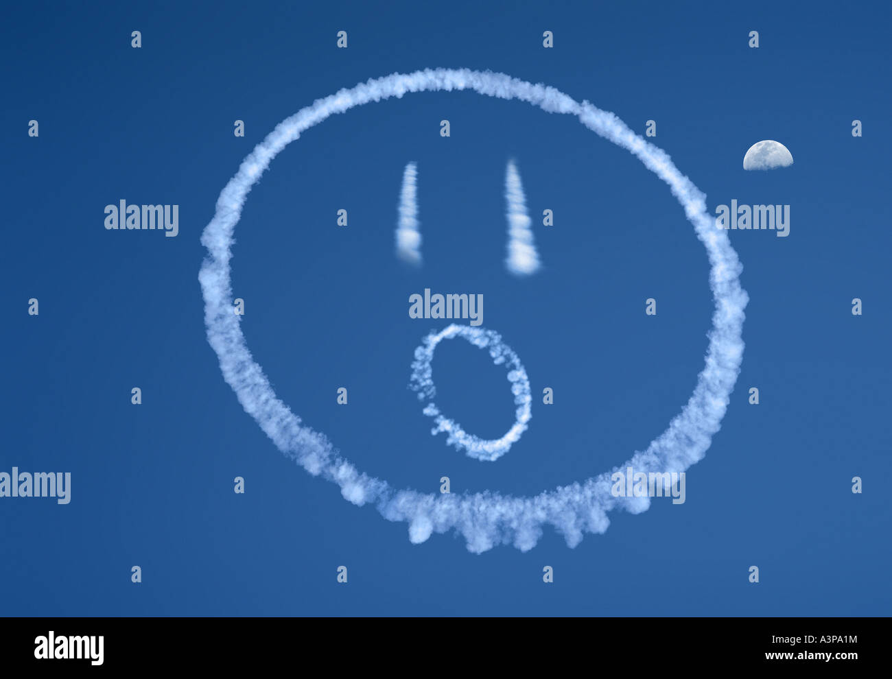 Smiley face with an astonished or surprised expression in smoke trail ...