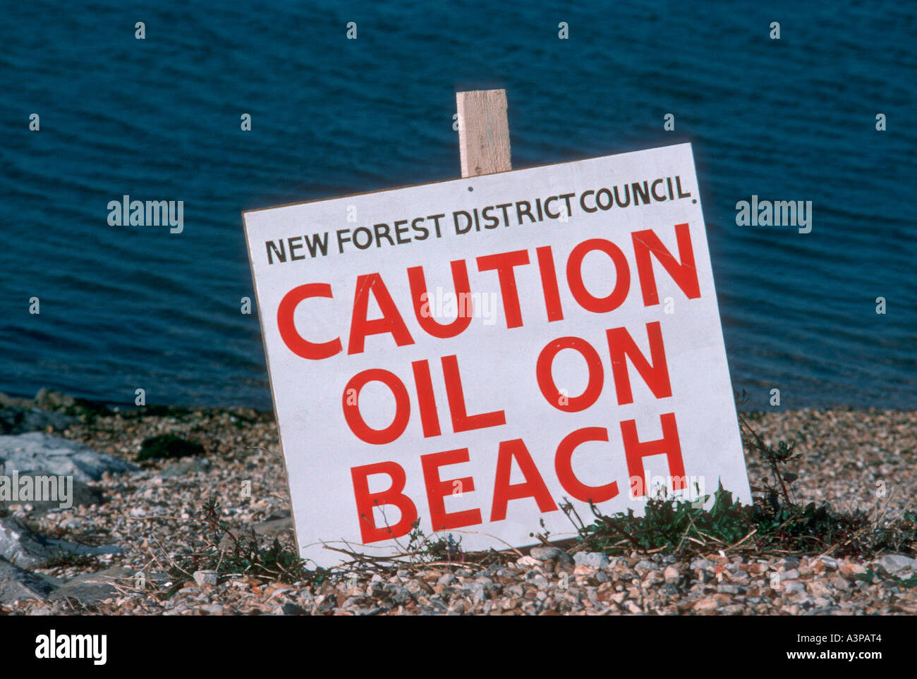 Caution Oil on Beach Sign Stock Photo - Alamy