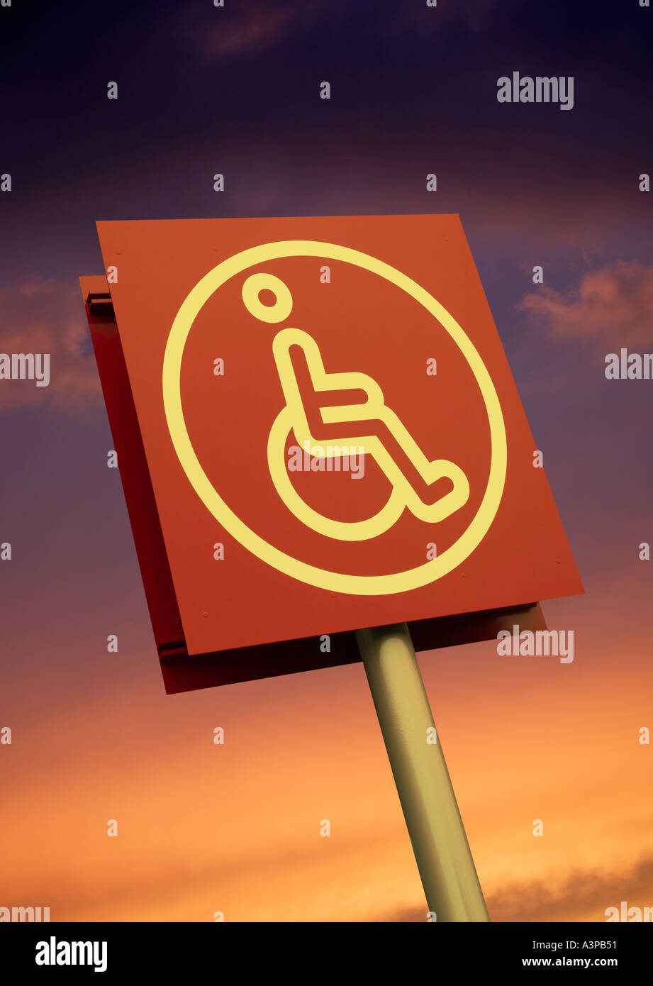 RECTANGULAR RED SIGN WITH ICON OF DISABLED PERSON IN WHEELCHAIR AGAINST ...