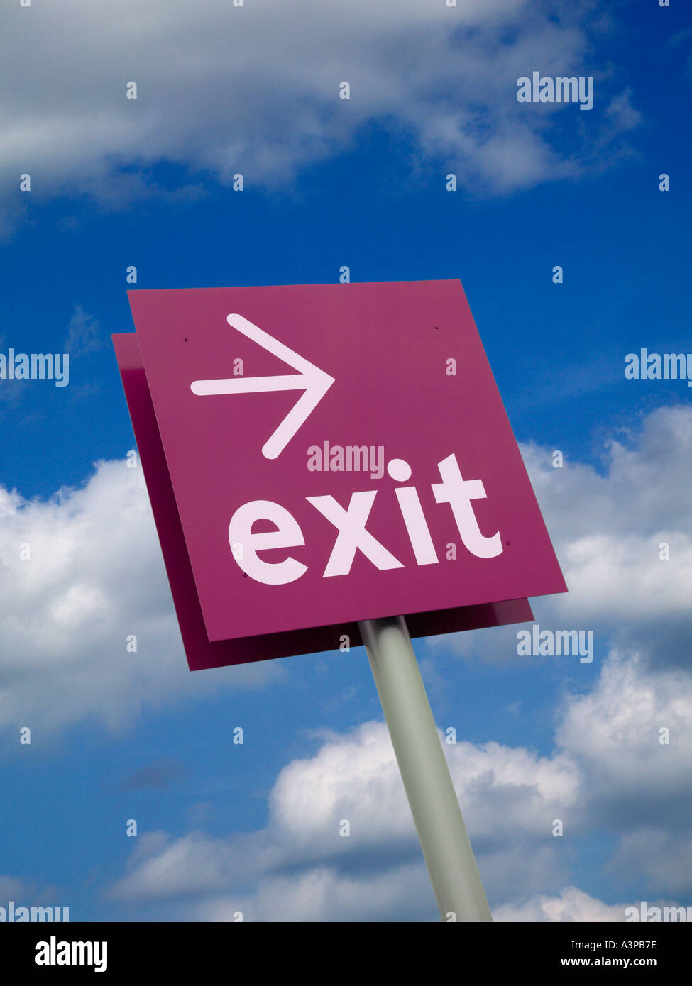 PURPLE EXIT SIGN WITH BLUE SKY BACKGROUND Stock Photo - Alamy