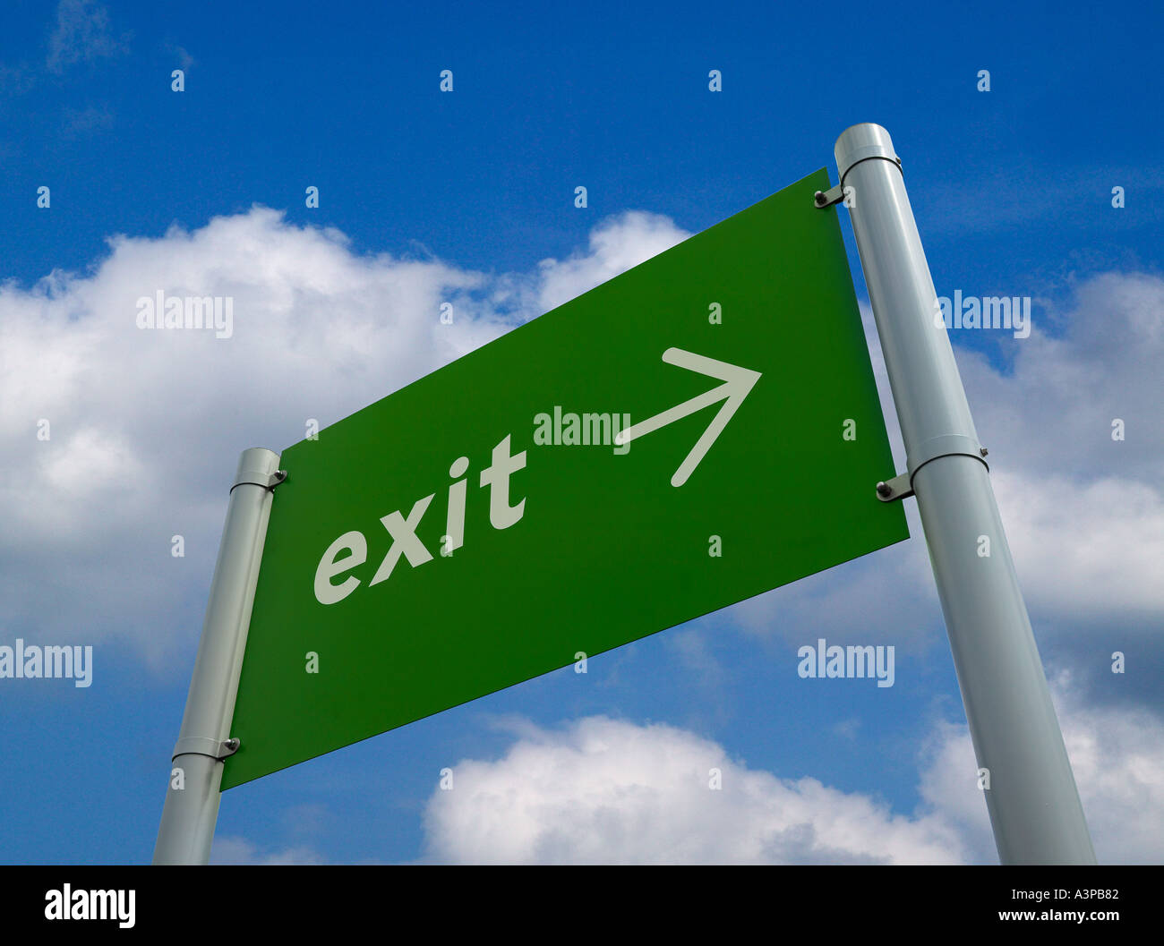 GREEN EXIT SIGN WITH BLUE SKY BACKGROUND Stock Photo - Alamy