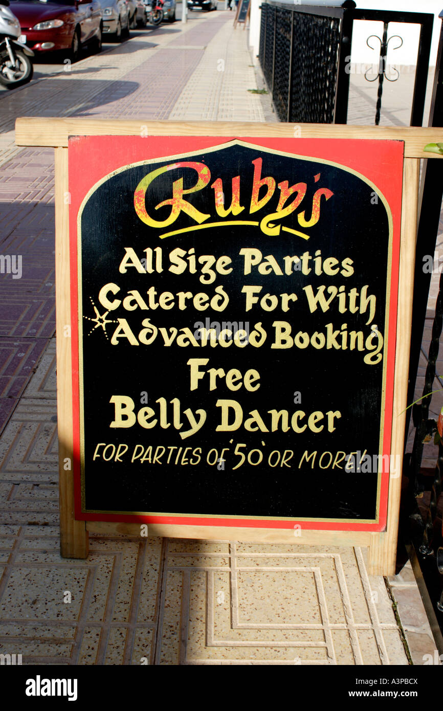 Indian restaurant sign advertising a free belly dancer Stock Photo - Alamy