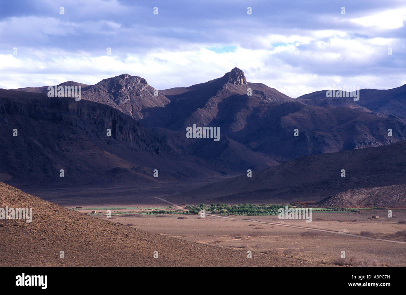 A valley oasis with a dramatic mountain backdrop near Agdz in southern ...