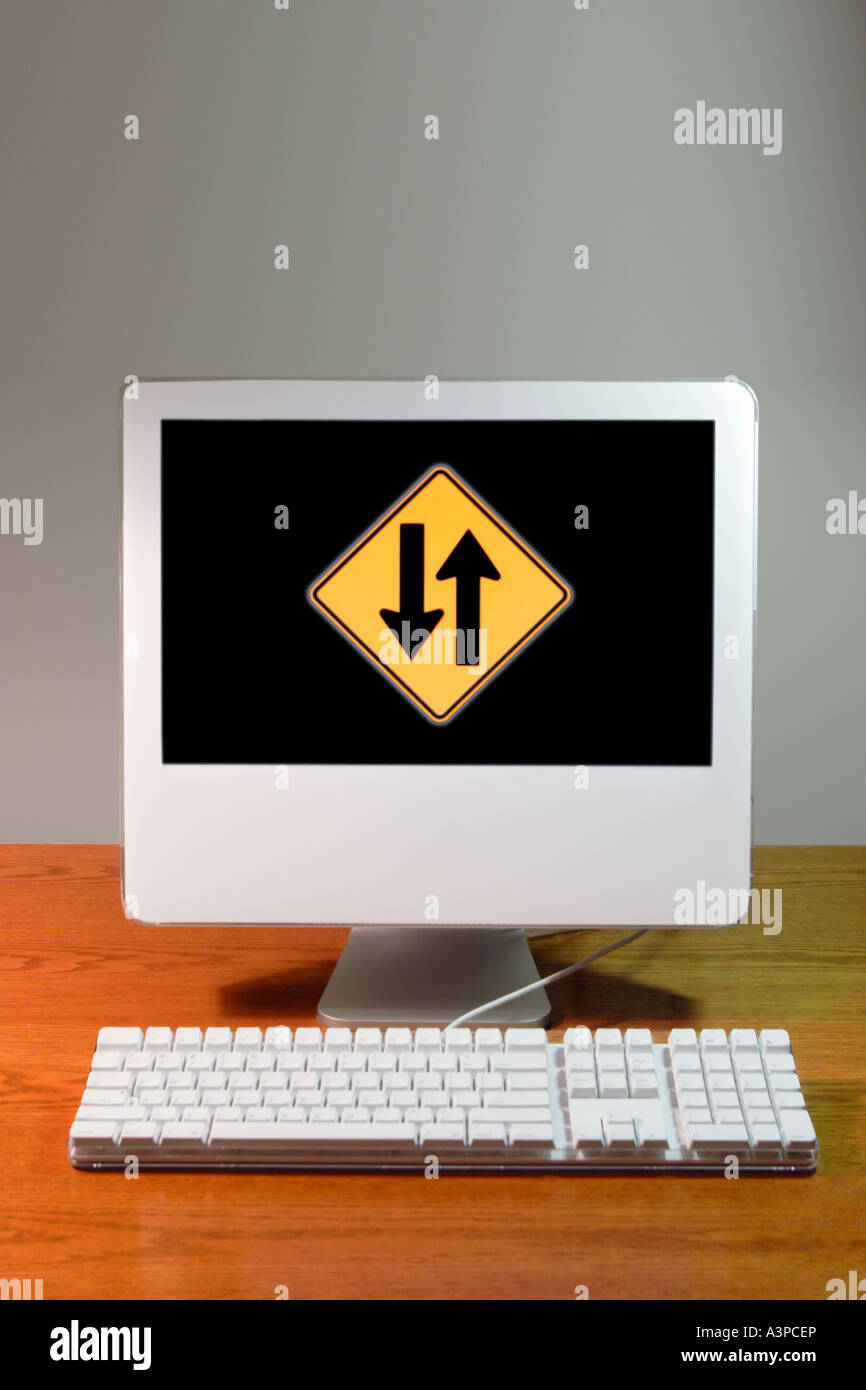 Apple computer with two way traffic road sign on screen Stock Photo - Alamy