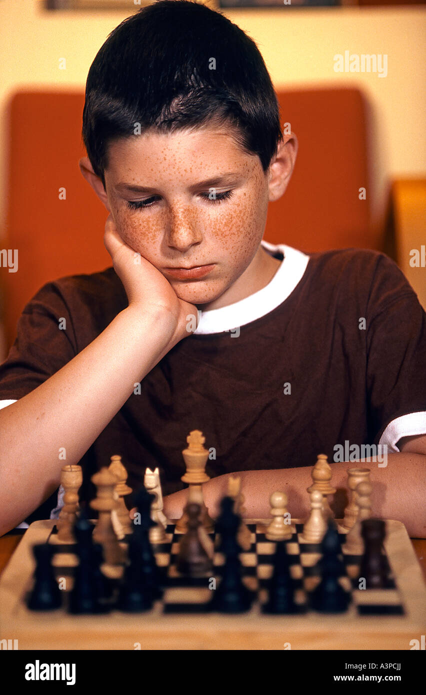 10 year old boy playing chess Stock Photo - Alamy