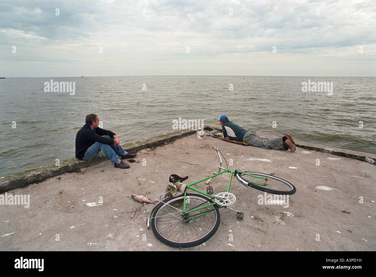 Men fishing on the coast of the Curonian Lagoon, Nida, Lithuania Stock ...