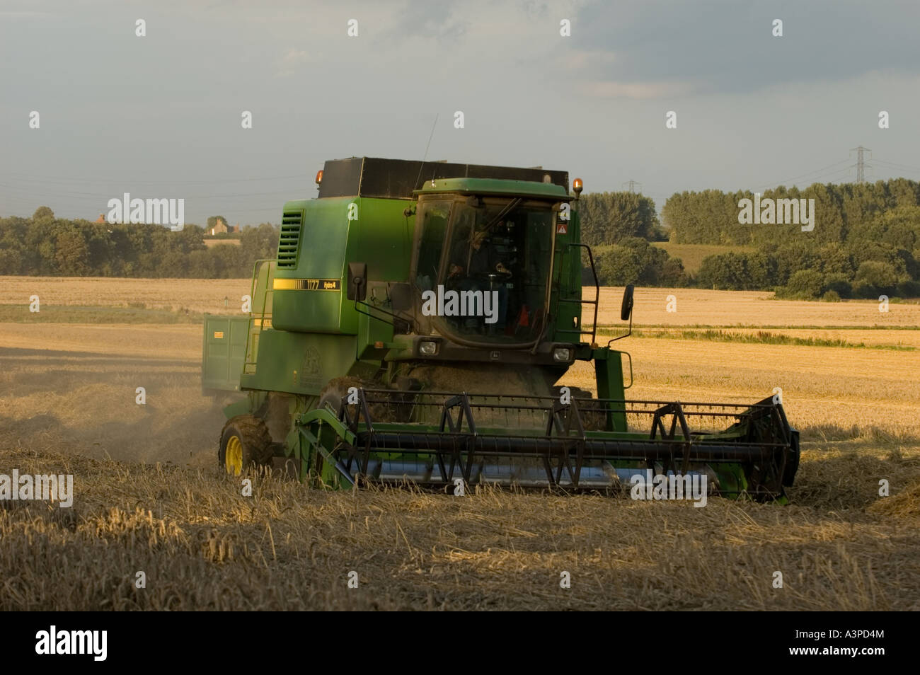 Combine Harvester at work in a field Stock Photo - Alamy