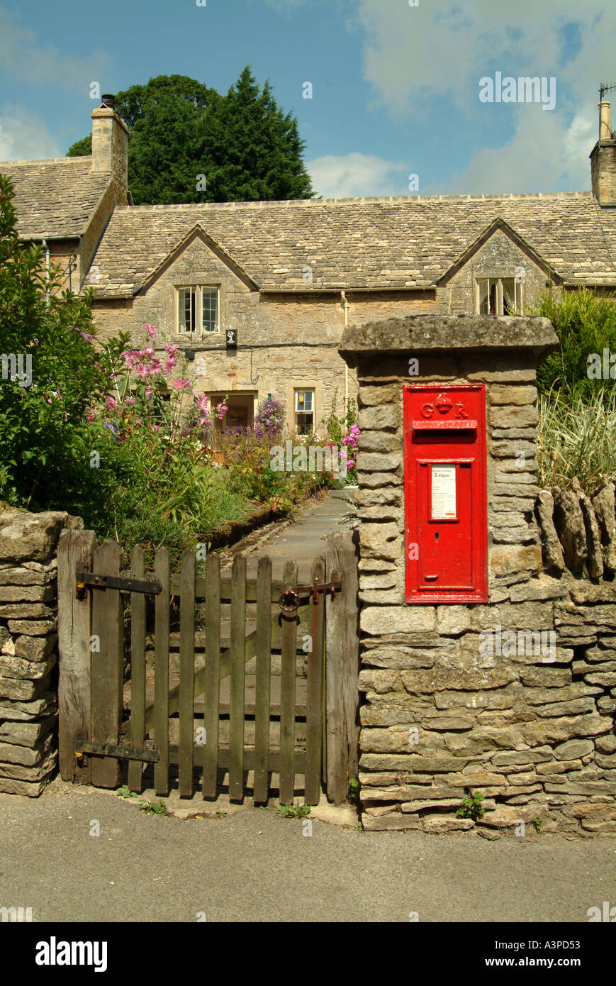 Cotswold stone cottages and red postbox Upper Slaughter Cotswolds ...