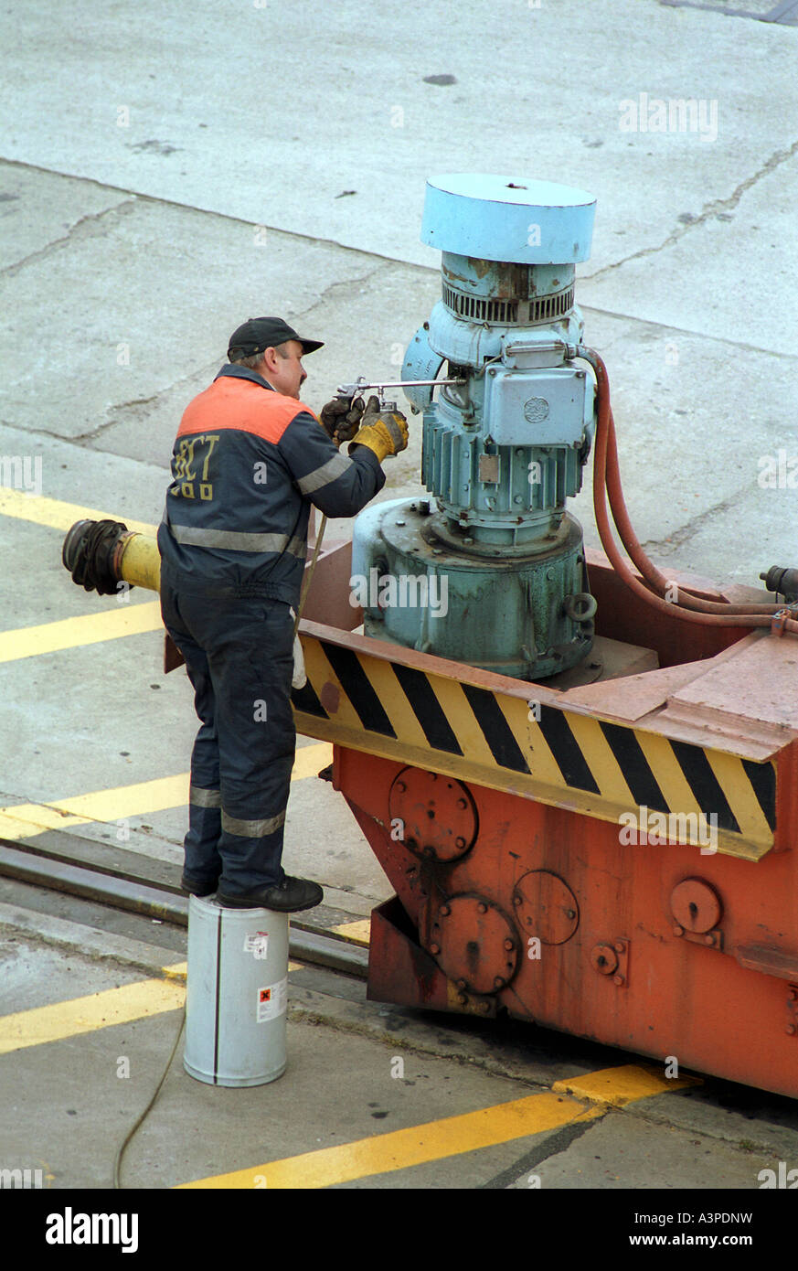 Shipyard worker repairing some equipment, Gdynia, Poland Stock Photo ...
