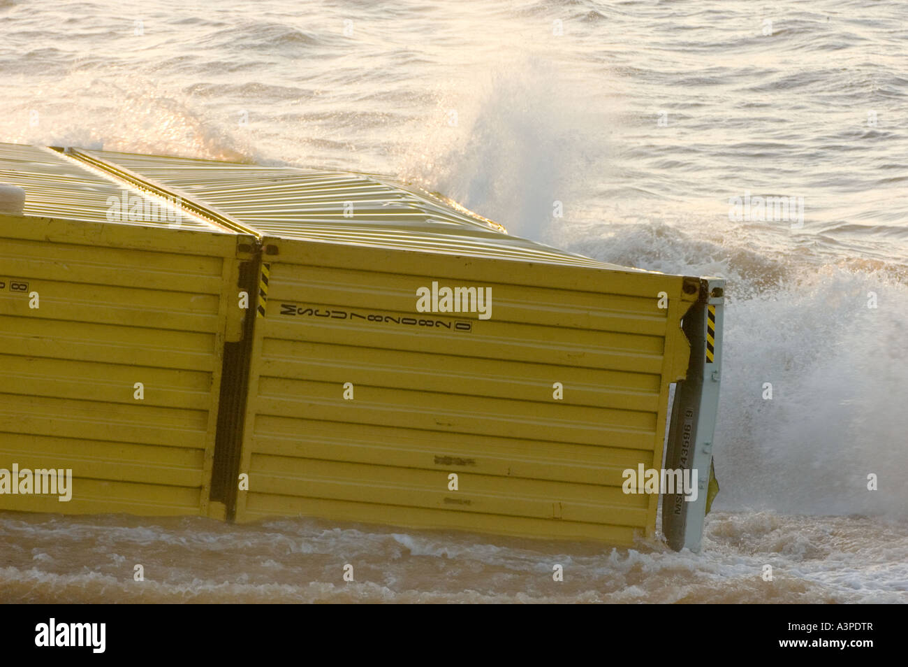 Close up container with waves breaking over it Stock Photo - Alamy
