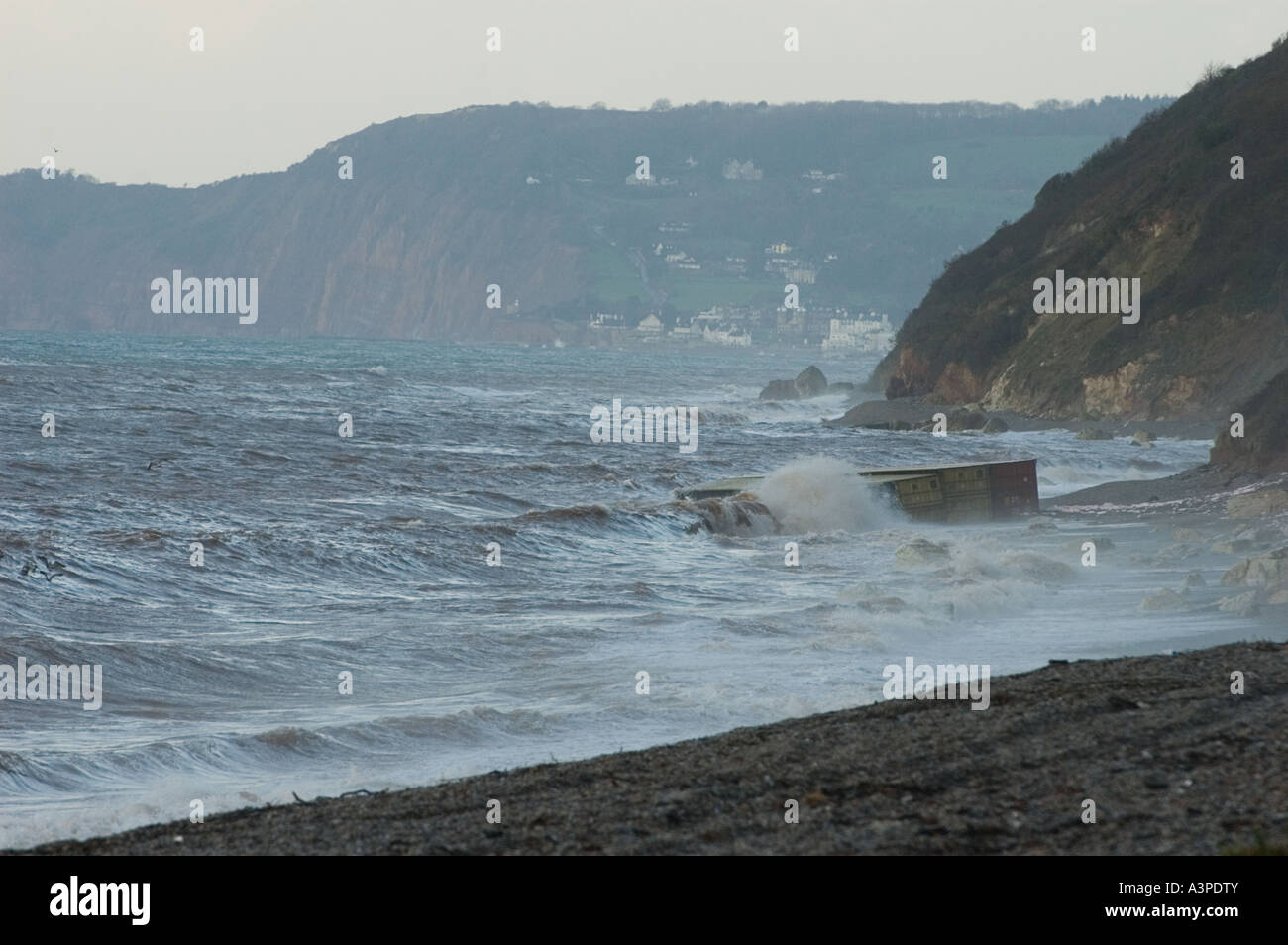 Container washed up on the branscombe beach shore Stock Photo - Alamy