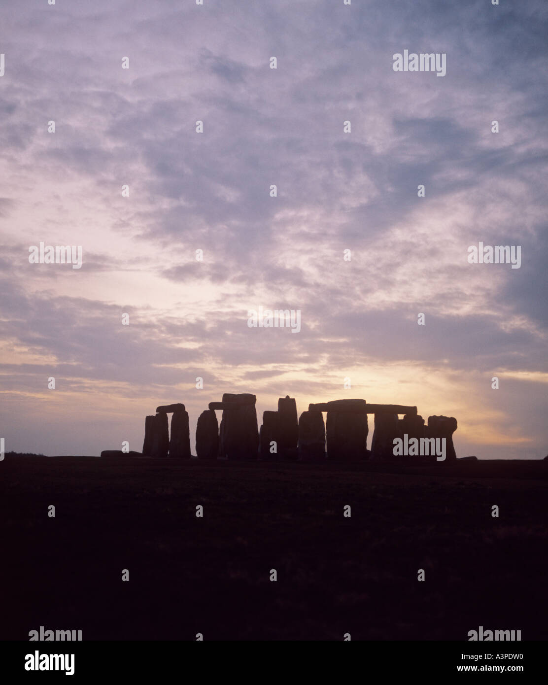 The massive Sarsen stones of Stonehenge circle against a sunset Stock ...