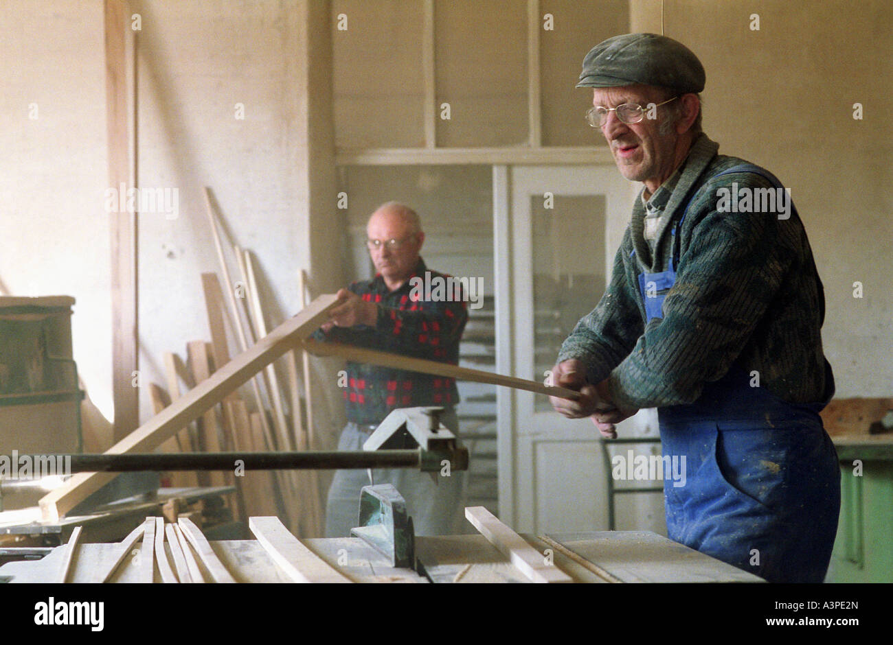 Two elderly carpenters at work, Poland Stock Photo - Alamy