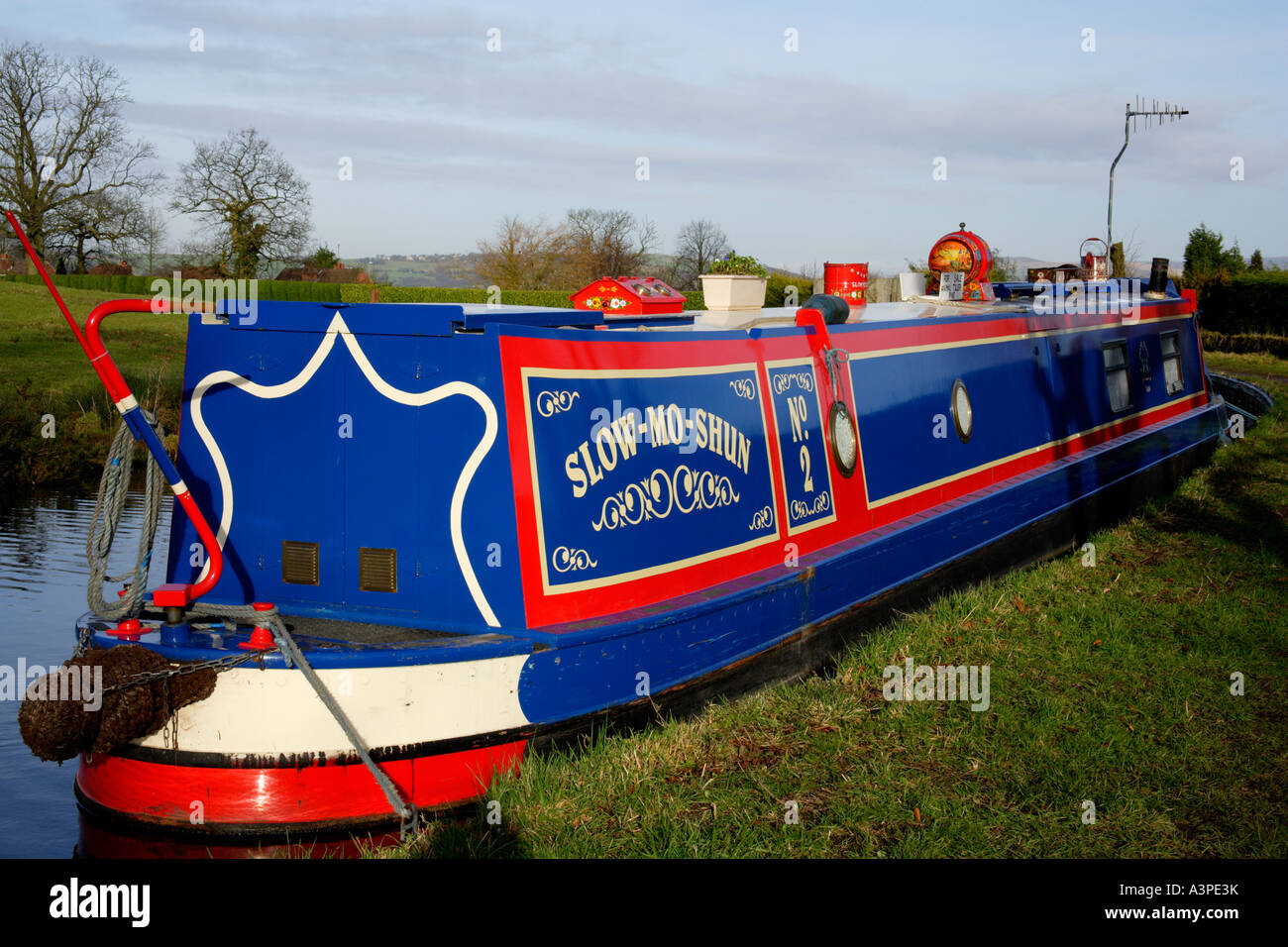 A colourful Narrow Boat moored on the Peak Forest Canal near Marple in ...