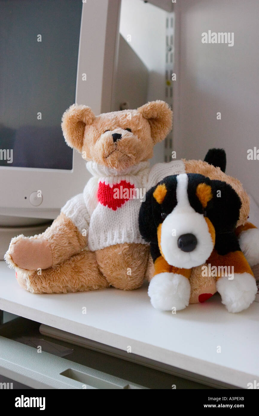 Toys on desk next to the computer monitor Stock Photo - Alamy