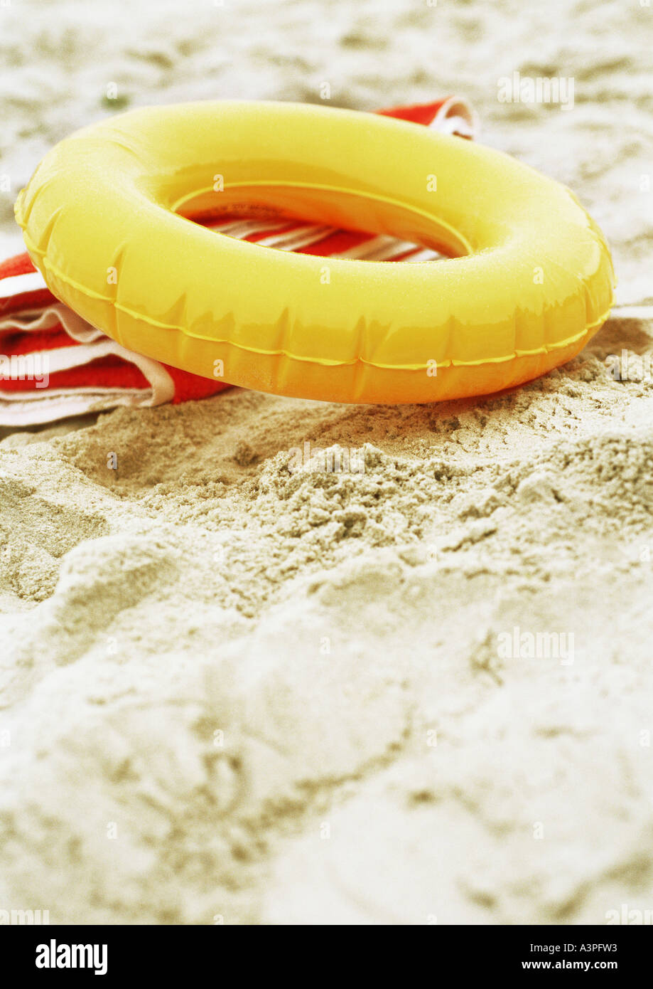 Innertube on beach Stock Photo - Alamy