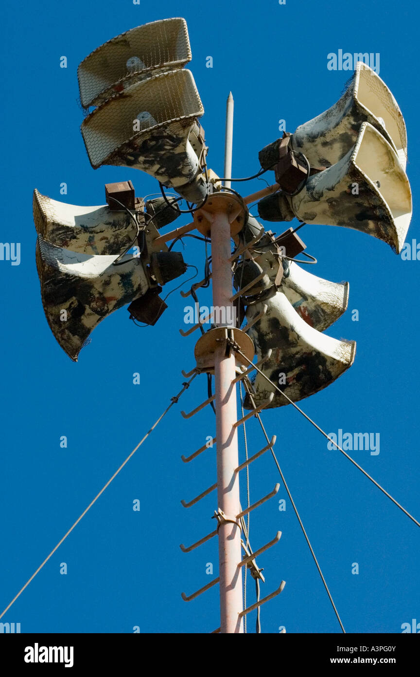 Warning speakers on a mast Stock Photo - Alamy